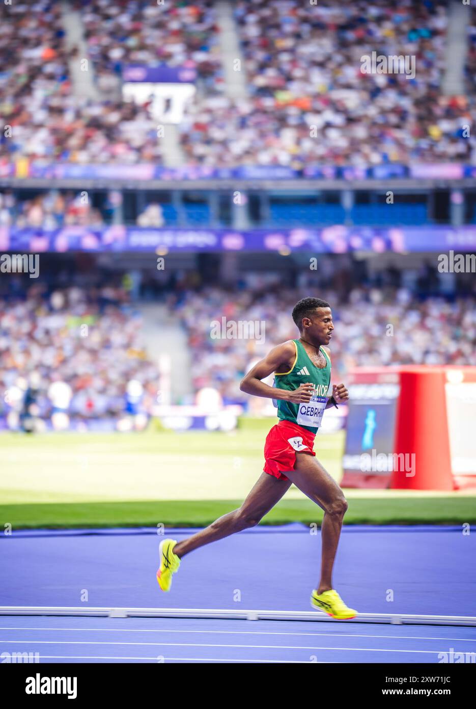 Hagos Gebrhiwet participating in the 5000 meters at the Paris 2024 ...