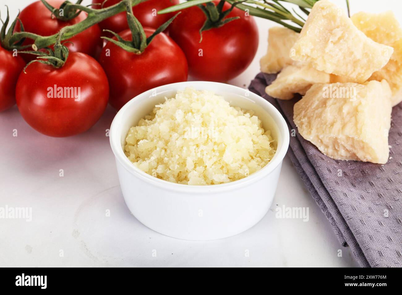 Shredded Italian hard parmesan cheese in the bowl Stock Photo - Alamy
