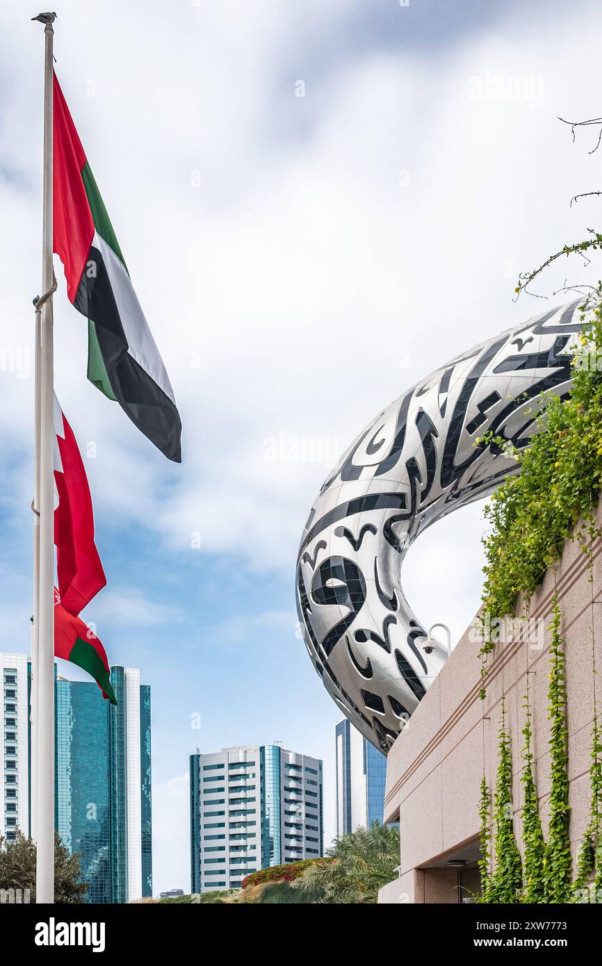 United Arab Emirates UAE national flag waves on air in the sky in front ...
