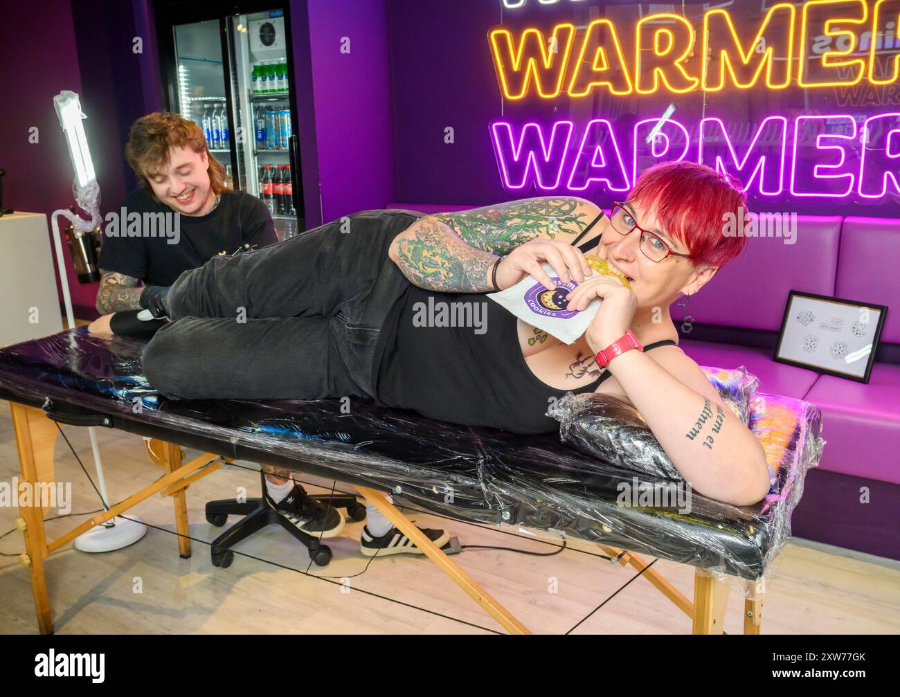 EDITORIAL USE ONLY Charlotte Istance gets a tattoo as tattoo artist ...