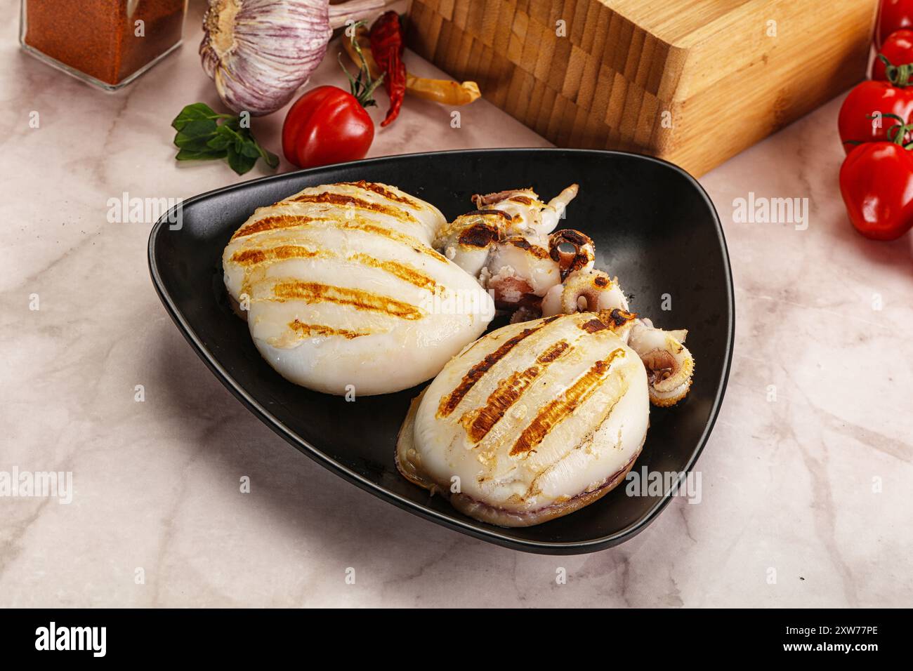 Grilled gourmet cuttlefish in the plate Stock Photo - Alamy