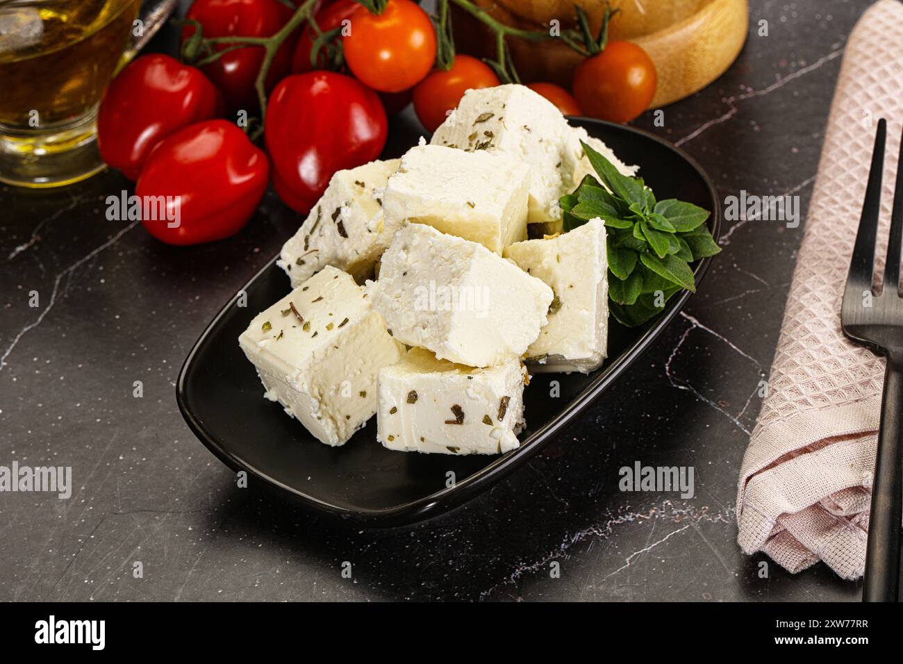 Greek traditional Feta cheese cubes with herbs and spices Stock Photo ...