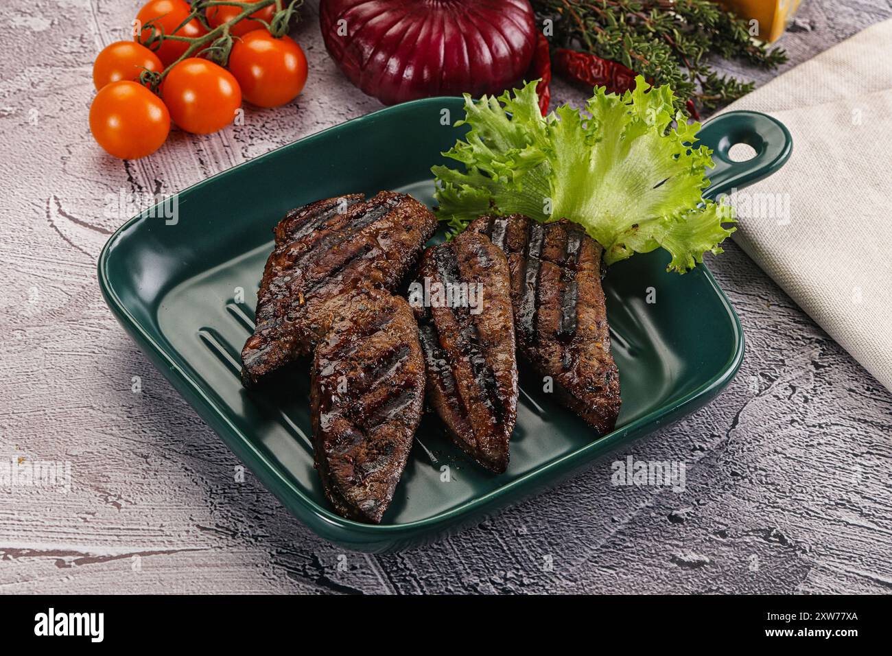 Grilled diet beef liver steak in the plate Stock Photo - Alamy