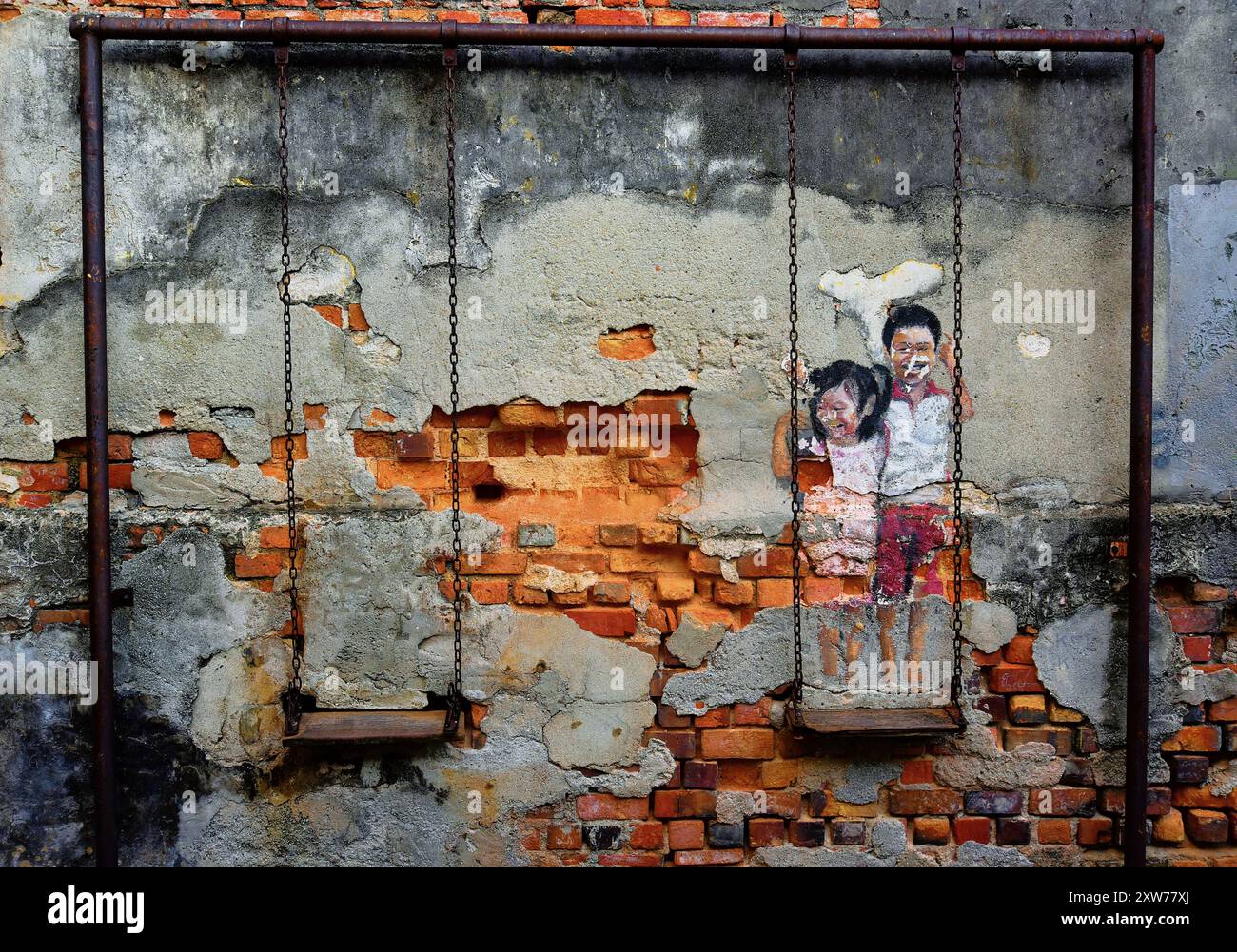 Playful wall murals and street art of Georgetown, Penang, Malaysia. Brother and sister on a ...