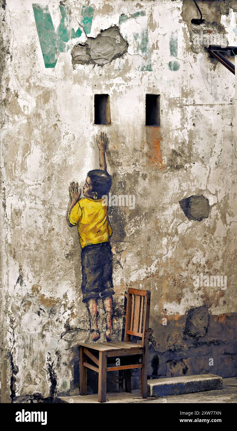 Playful wall murals and street art of Georgetown, Penang, Malaysia. Boy ...