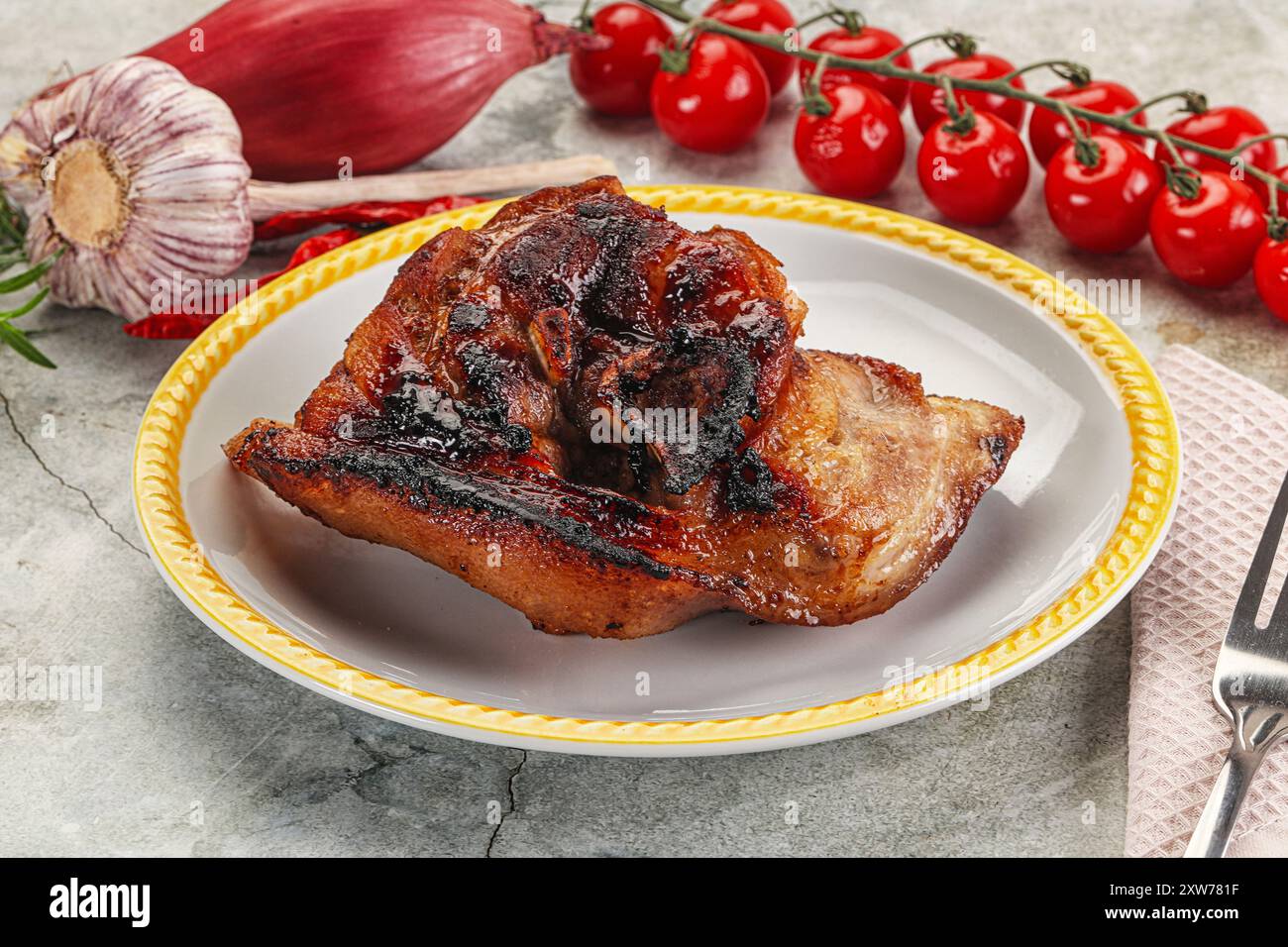 Roasted pork knuckle steak with bone Stock Photo - Alamy