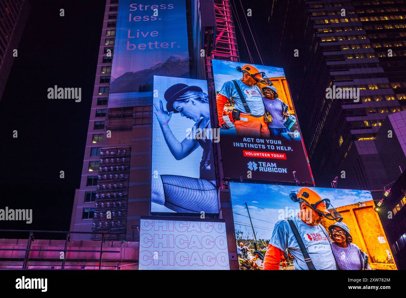 Close up view of Broadway, New York at night with skyscrapers featuring ...