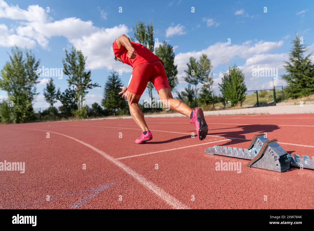 Stadium, man running and start block of athlete on a runner and arena ...