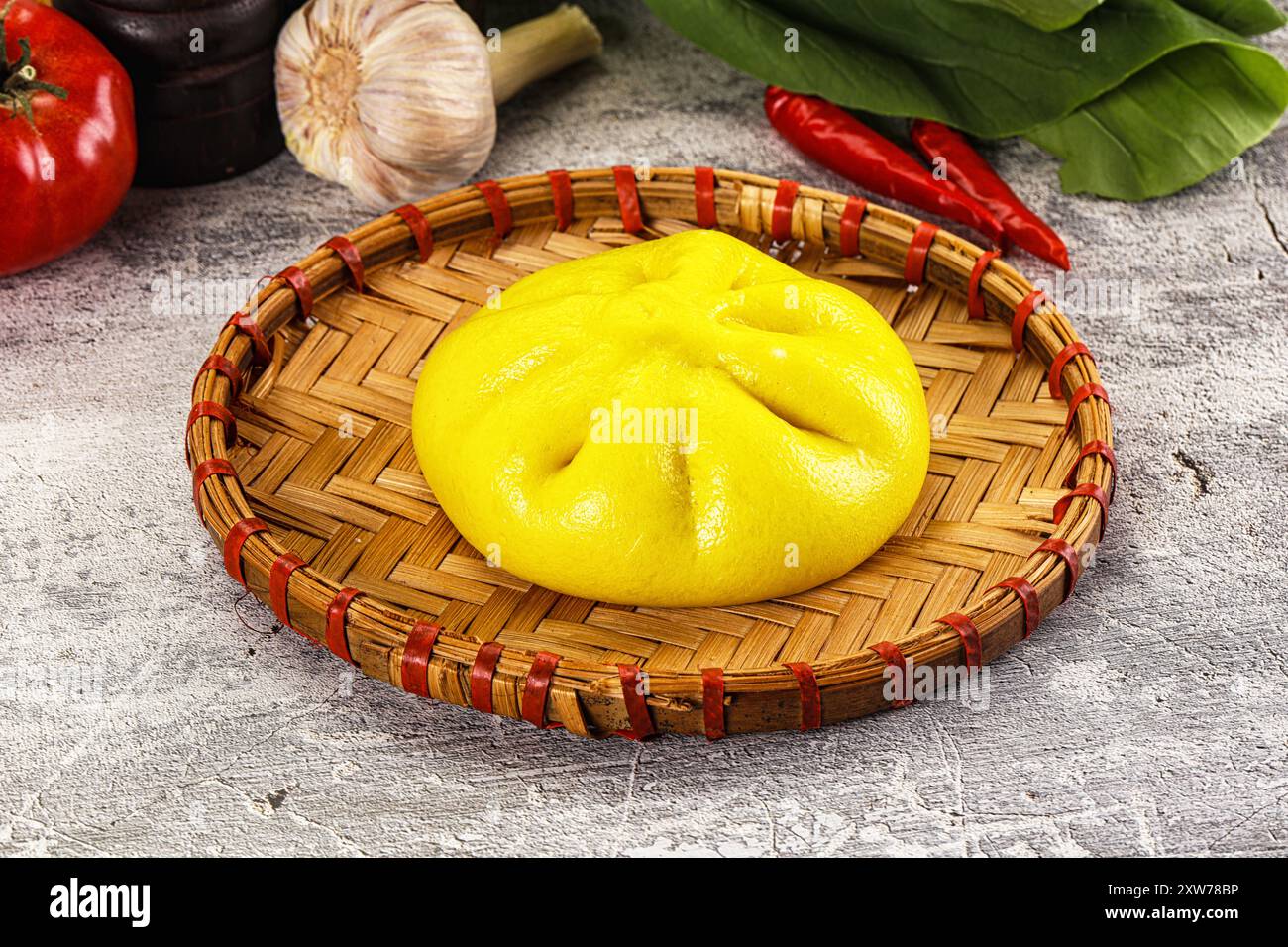 Asian stuffed steamed yellow Bun Bao Stock Photo - Alamy
