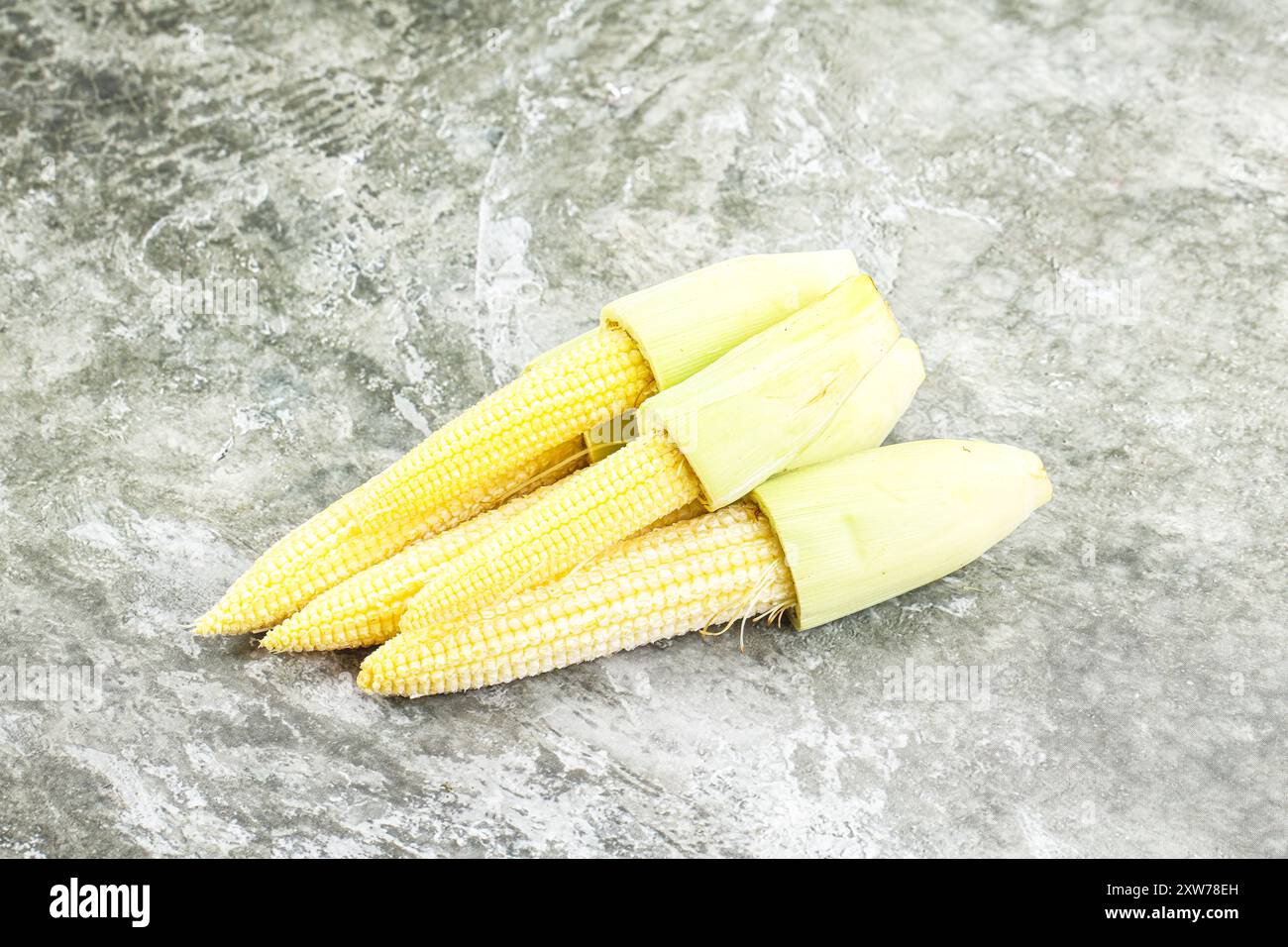 Small young sweet baby corn heap Stock Photo - Alamy