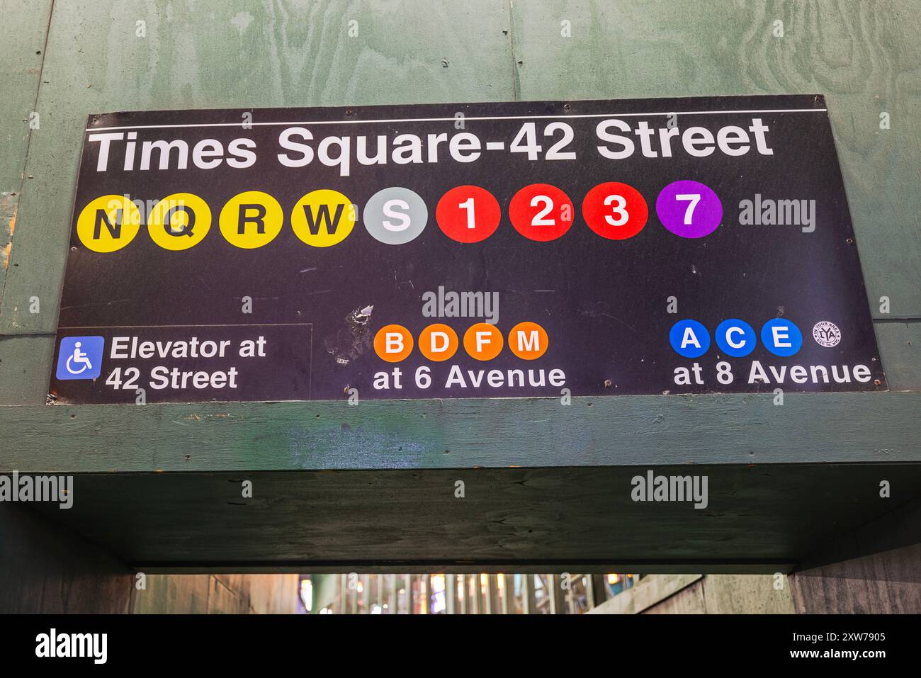 Times Square subway station sign at 42nd Street, featuring elevators ...