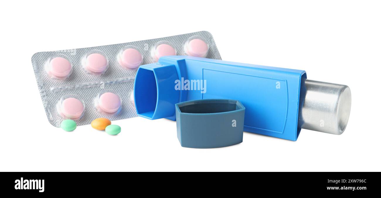 Asthma treatment. Inhaler and pills isolated on white Stock Photo - Alamy