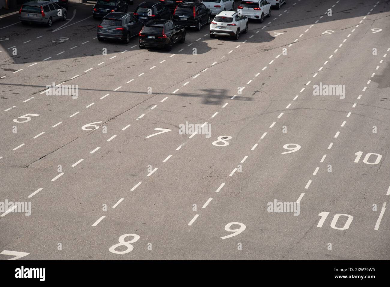 Vehicles in a raw on the port terminal ready for loading in a ferry ...