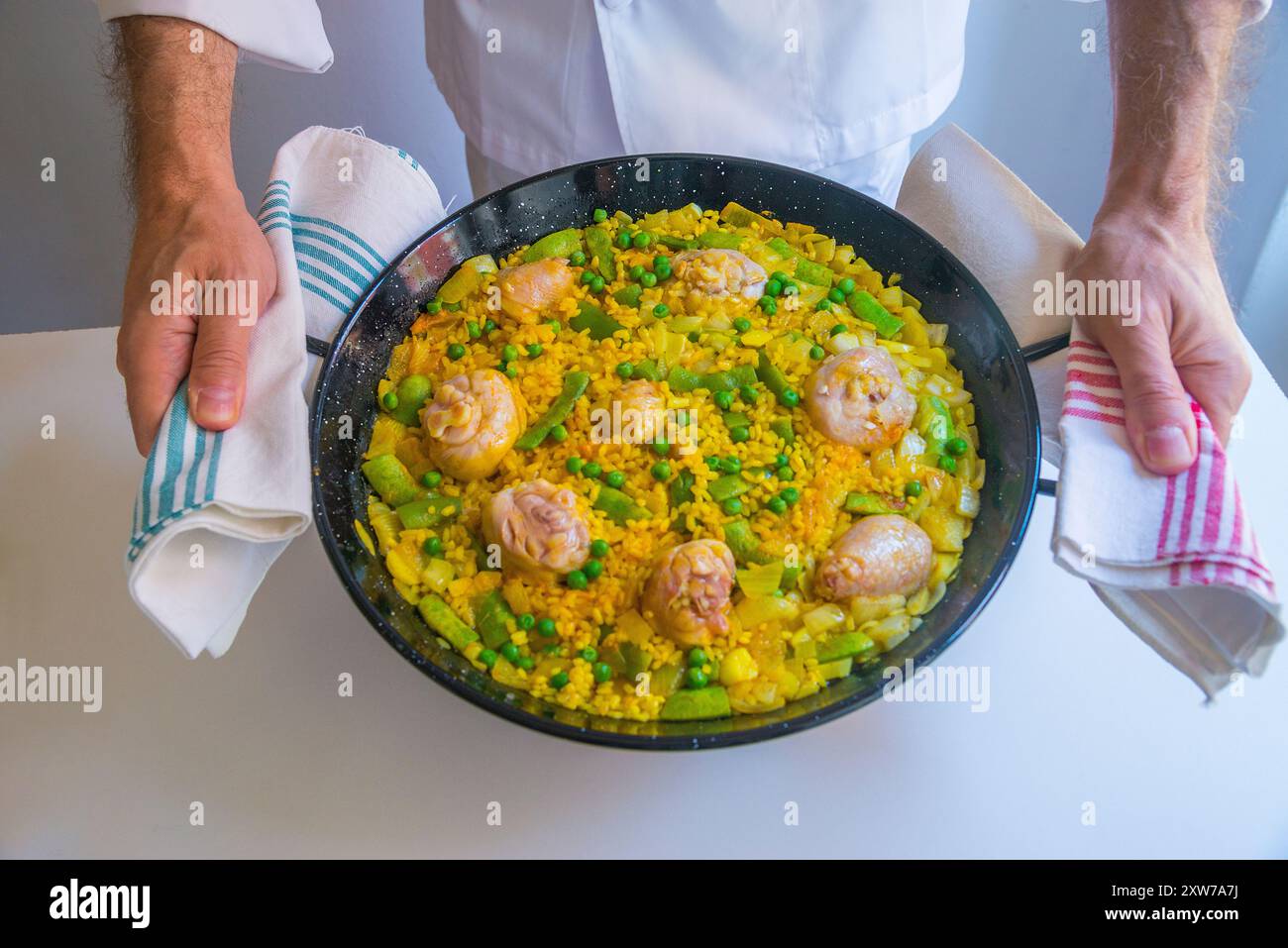 Chef holding paella spain hi-res stock photography and images - Alamy