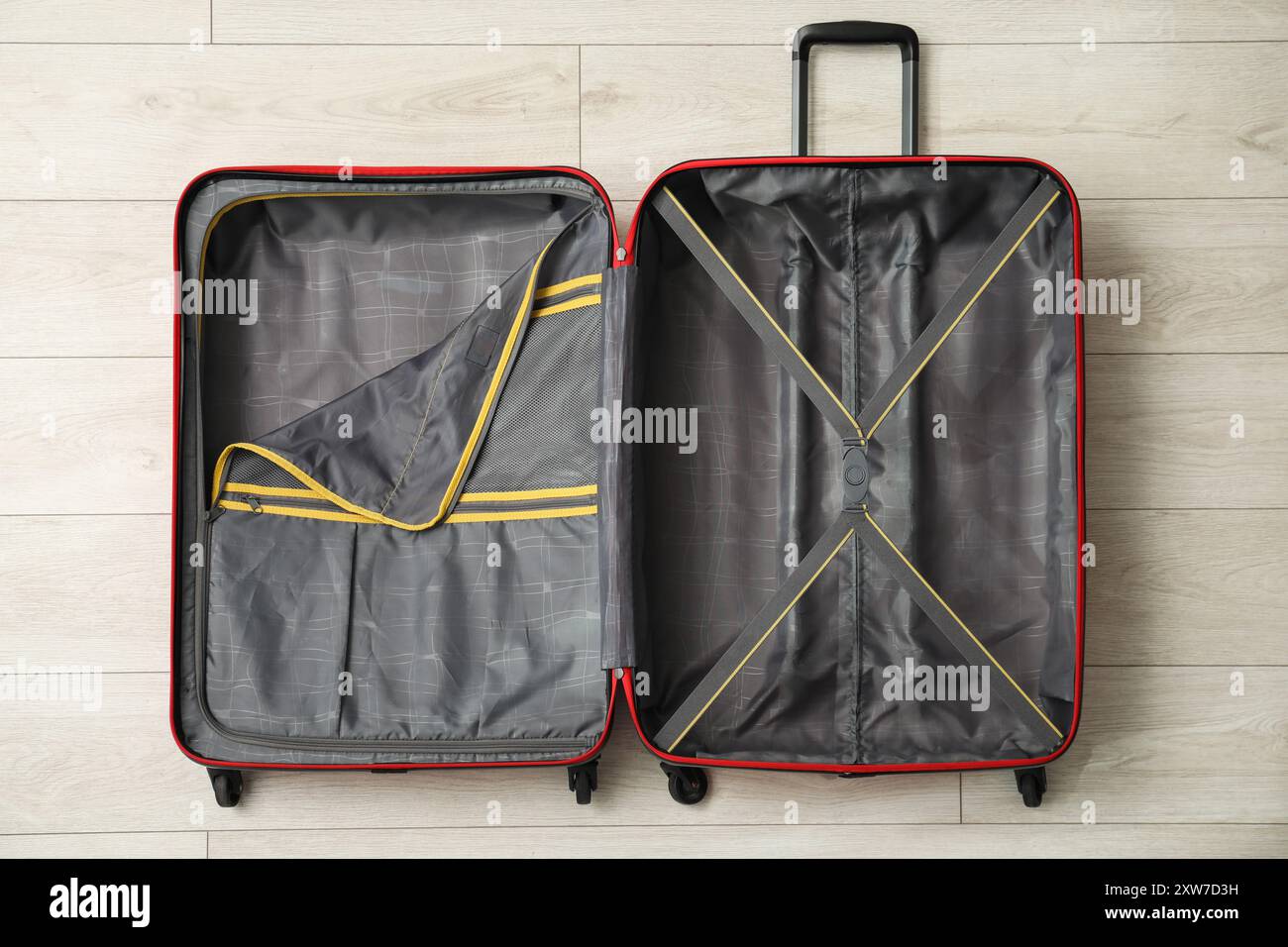 Open empty suitcase for travelling on floor indoors, top view Stock ...