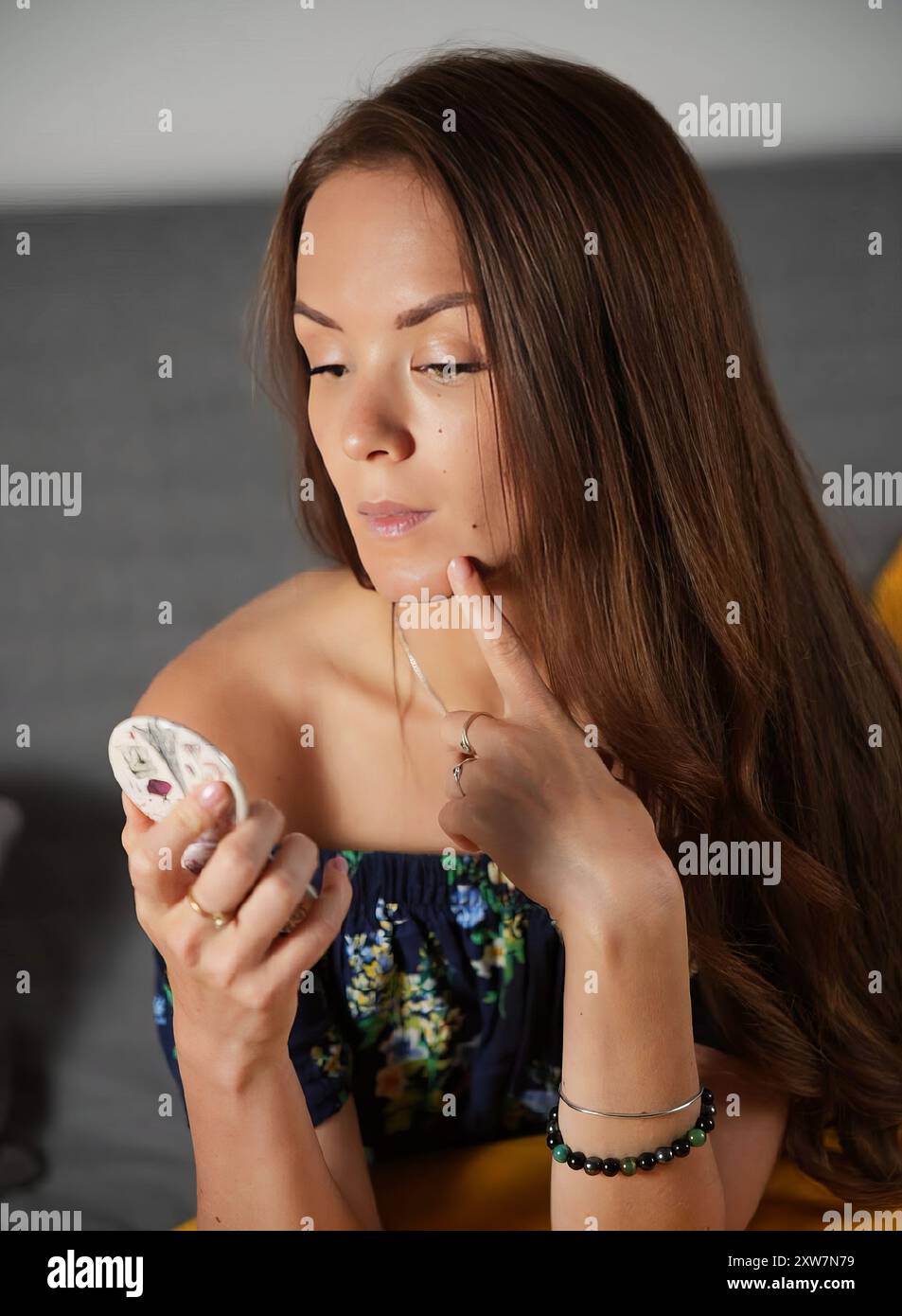 The girl looks into a small vertical Stock Photo - Alamy