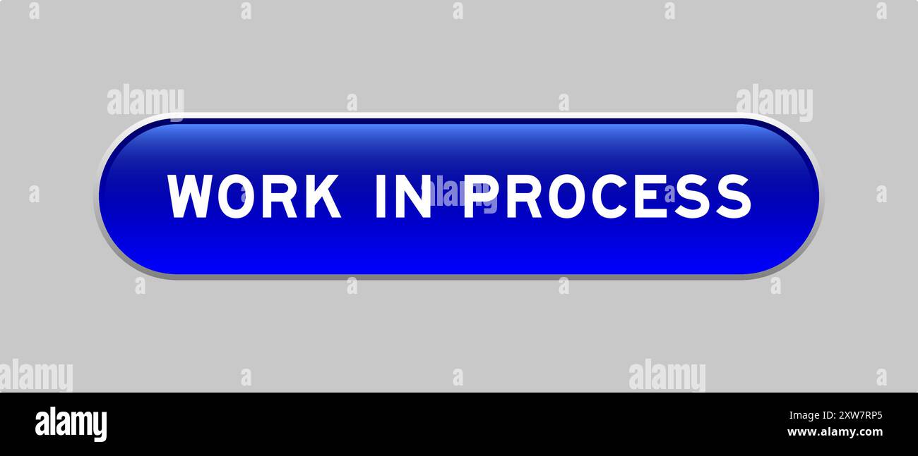 Blue color capsule shape button with word work in process on gray ...