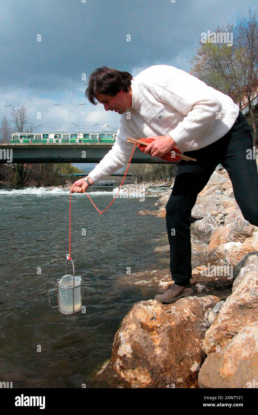 taking a sample to measure and analyse the water quality taking sample ...