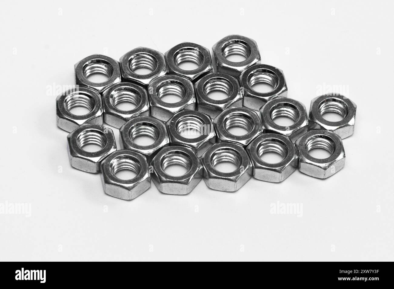 metal nuts isolated on white background Stock Photo - Alamy