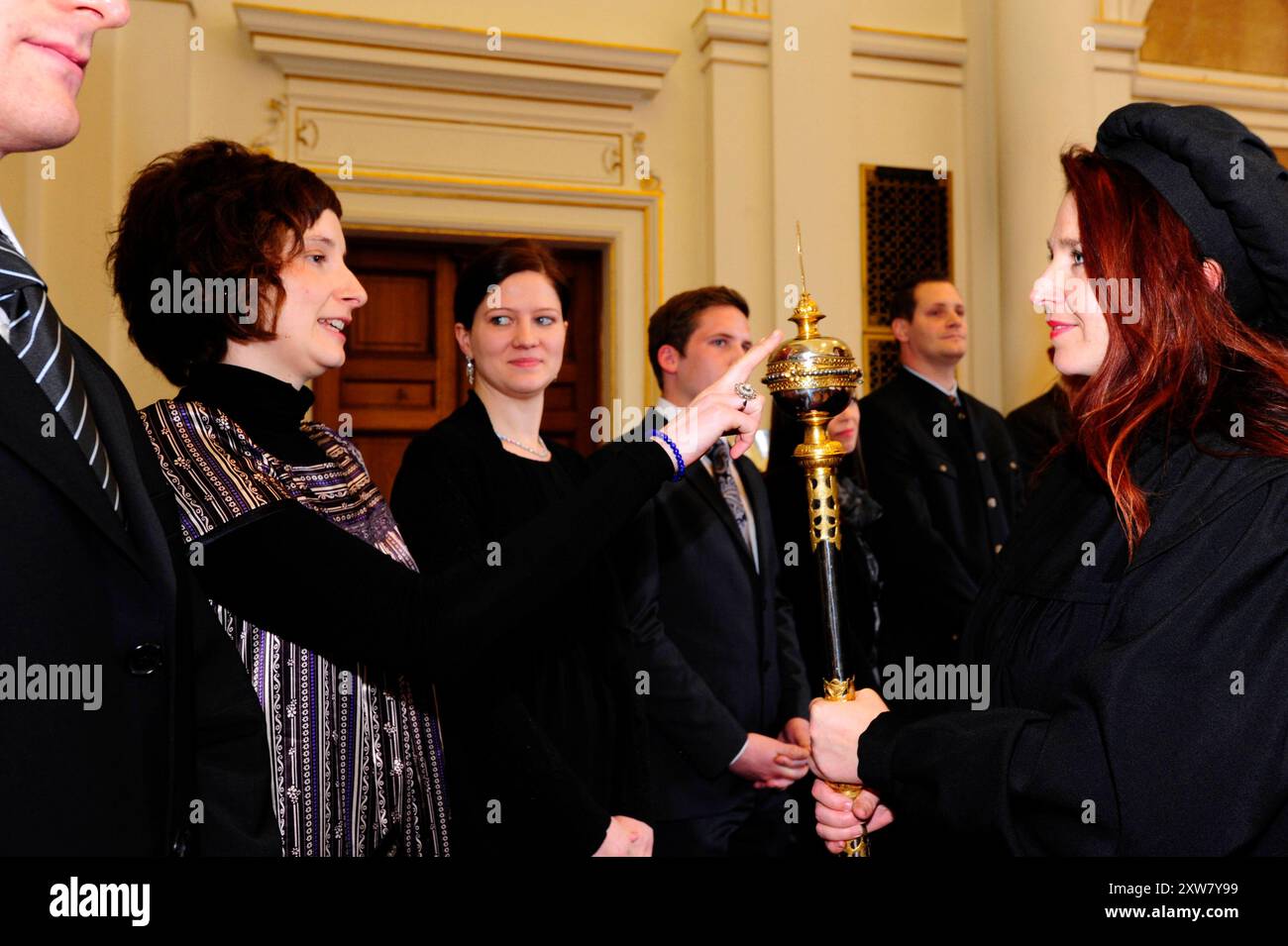 an university degree and graduation as completion of studies at the ...