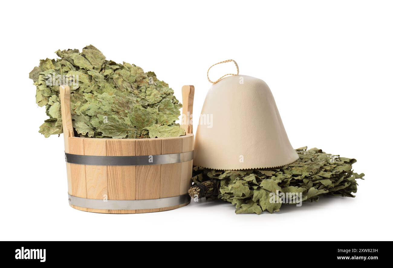 Sauna equipment. Wooden bucket, oak whisks and felt wool hat isolated ...