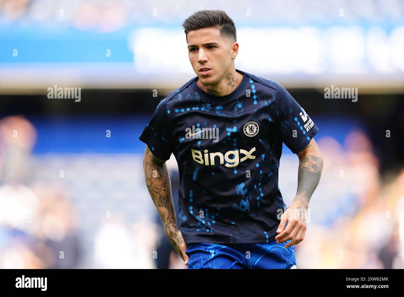 Chelsea's Enzo Fernandez warms up ahead of the Premier League match at ...