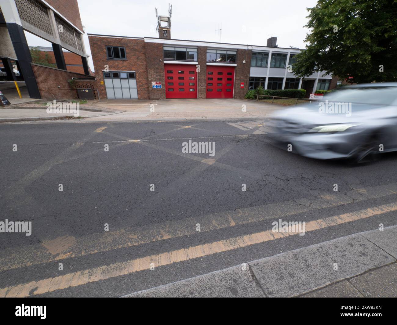 Faded and Worn box Junction outside fire station Loughton, Essex Stock ...