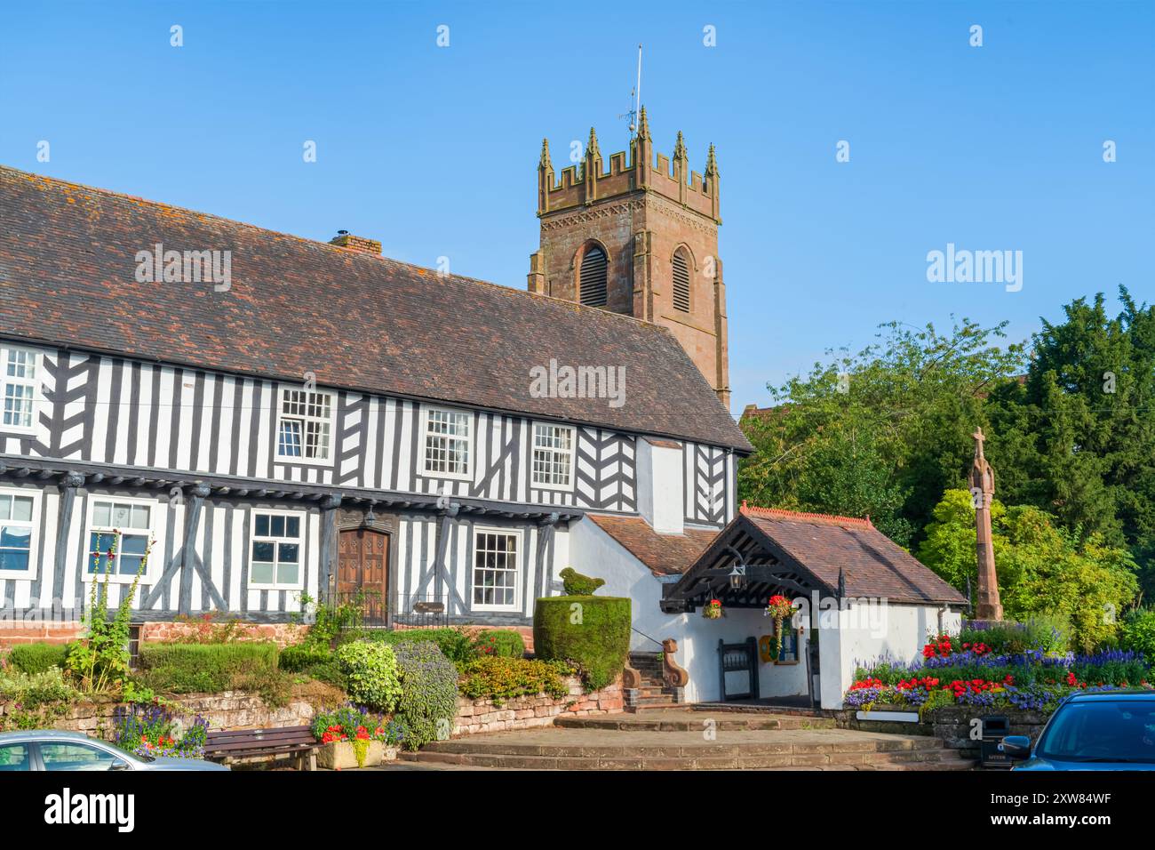 Traditional English village view with timber framed building in ...