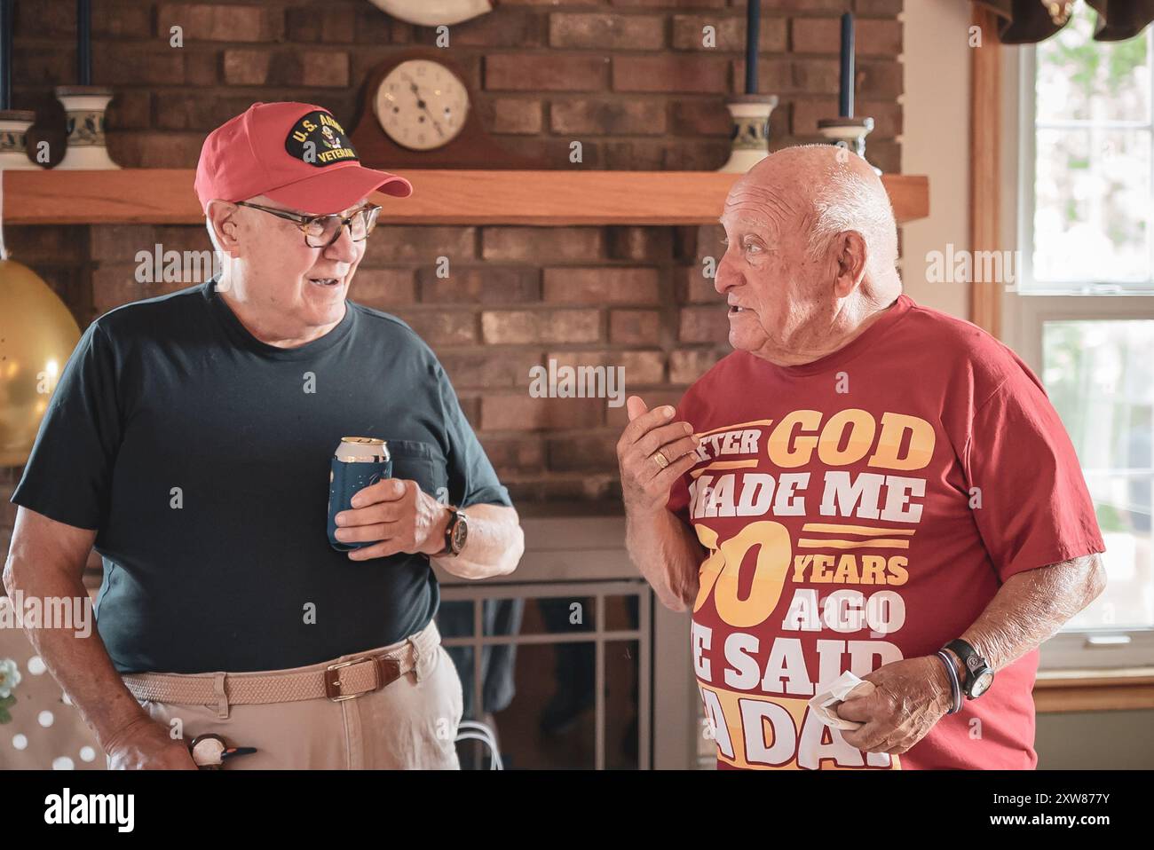 Two elderly men talking at pary Stock Photo - Alamy