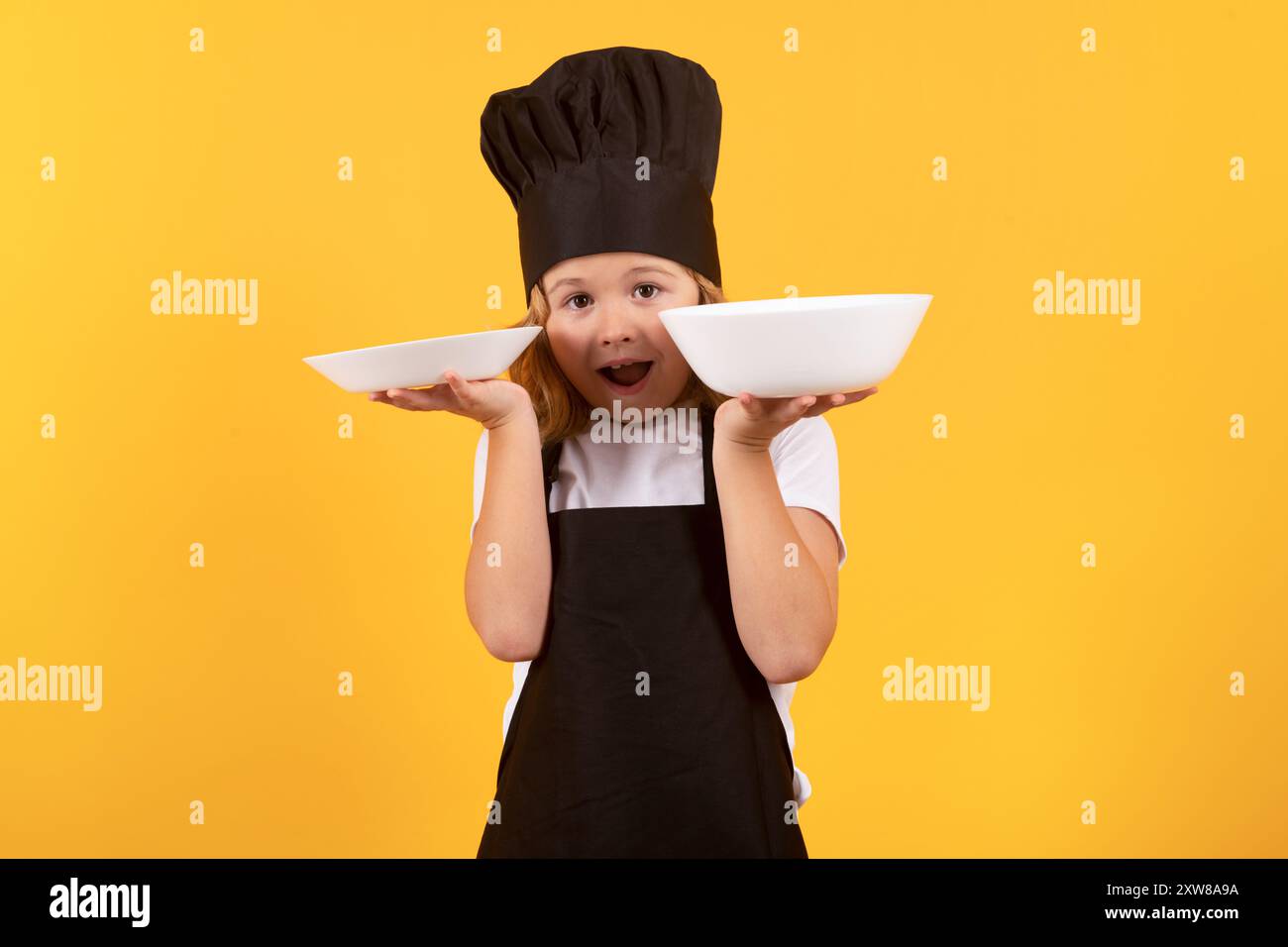 Little cook with cooking plate. Chef kid boy making healthy food ...