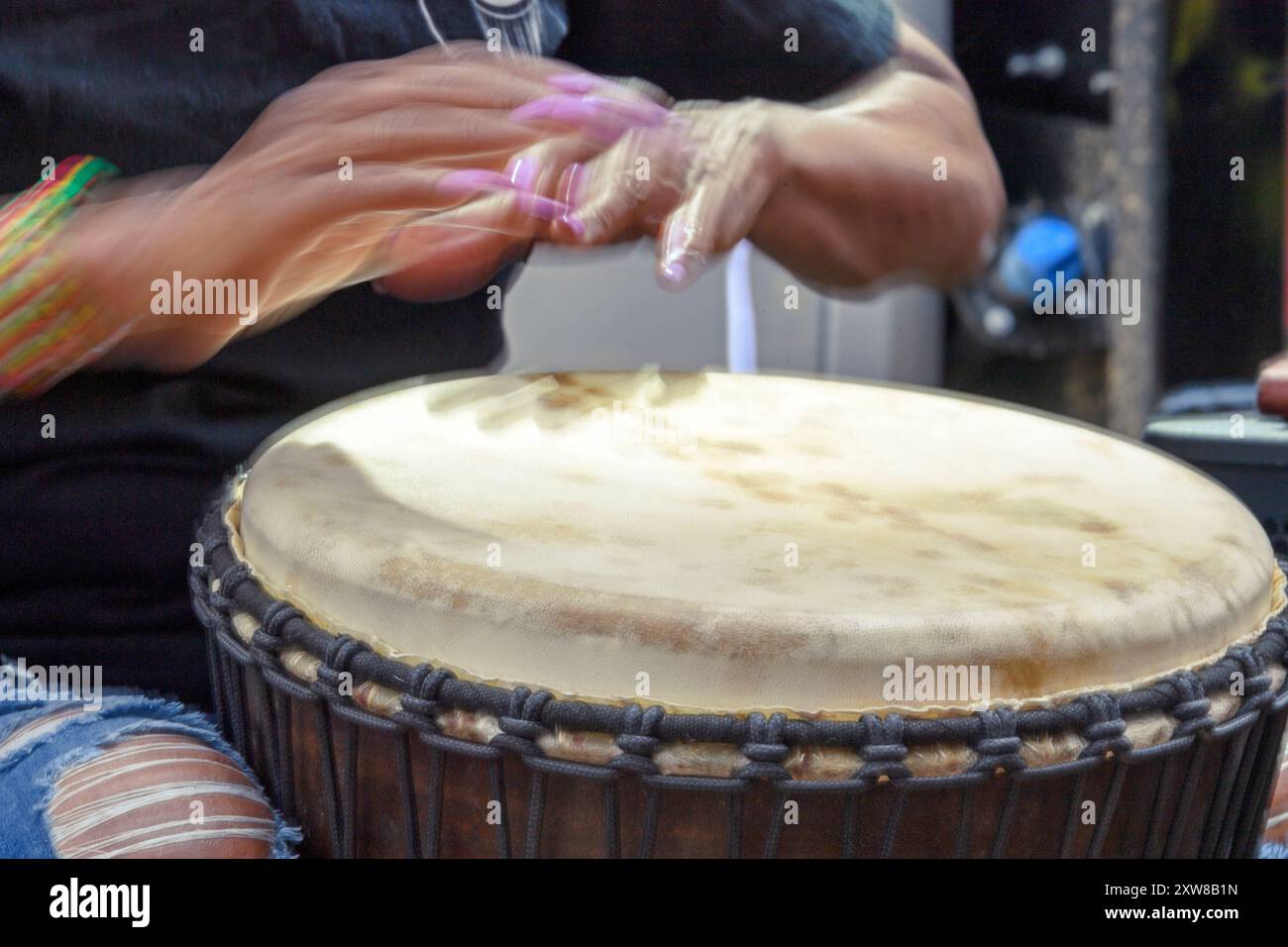 Female musician with a djembe drum hi-res stock photography and images ...