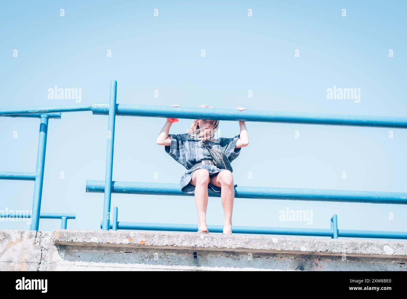 one person outdoors sitting alone Stock Photo - Alamy