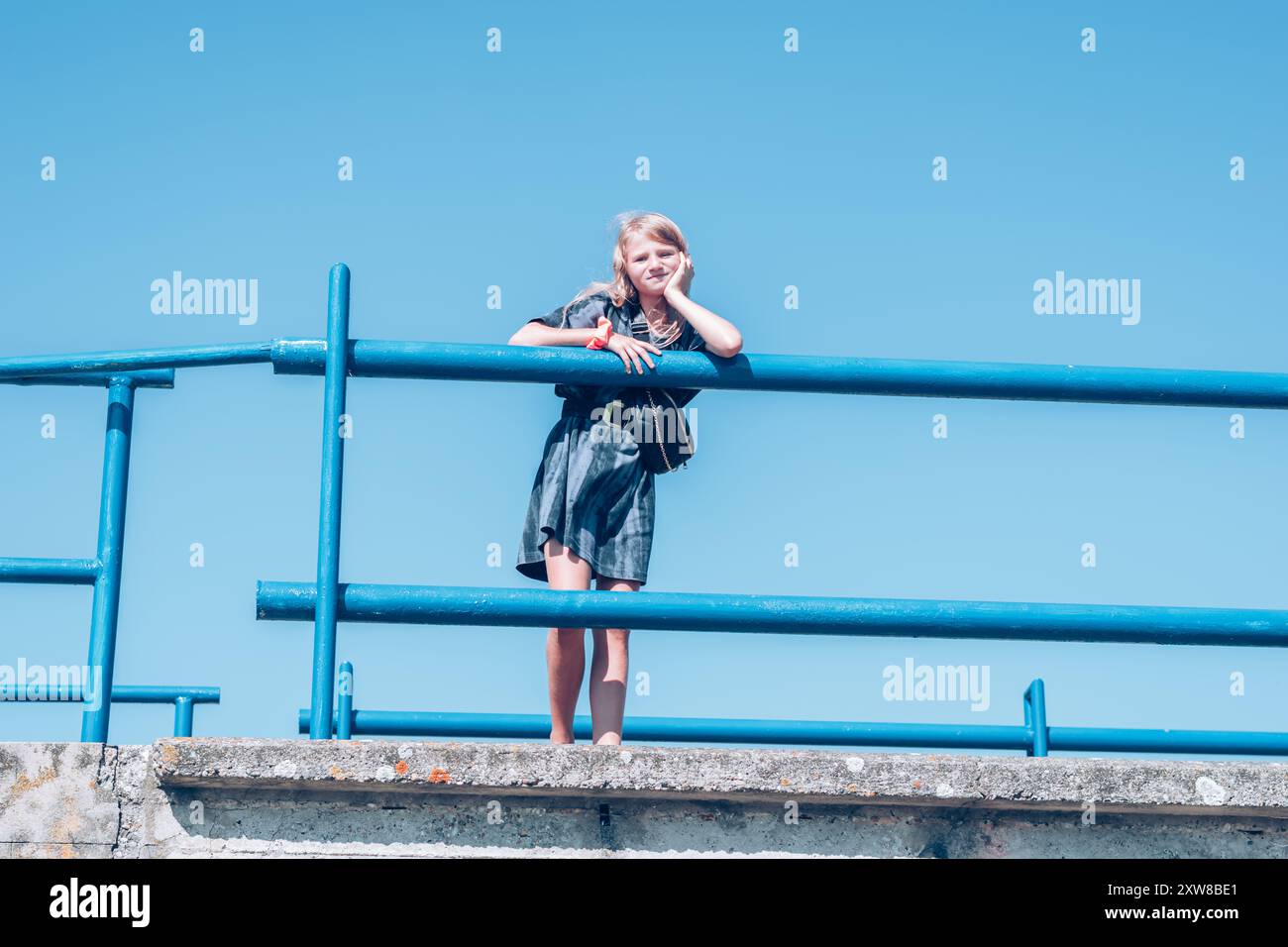 one person outdoors sitting alone Stock Photo - Alamy