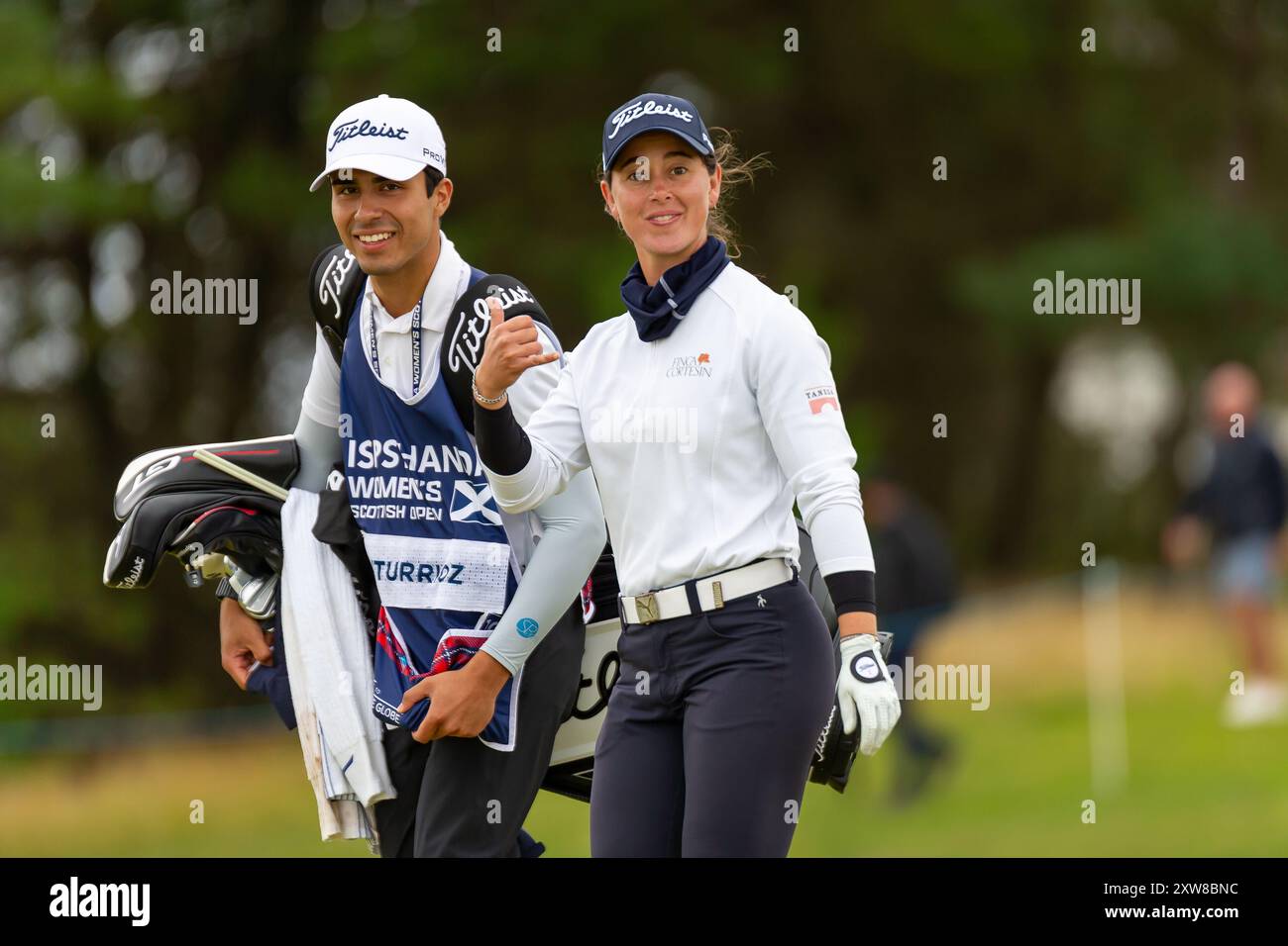 North Ayrshire, Scotland. 18th August 2024. Spanish golfer Nuria Iturrioz and her caddie during ...