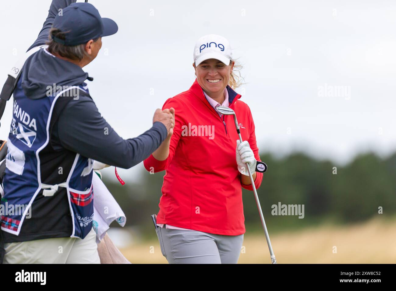 North Ayrshire, Scotland. 18th August 2024. Lauren Coughlin and her caddie celebrate a par save ...