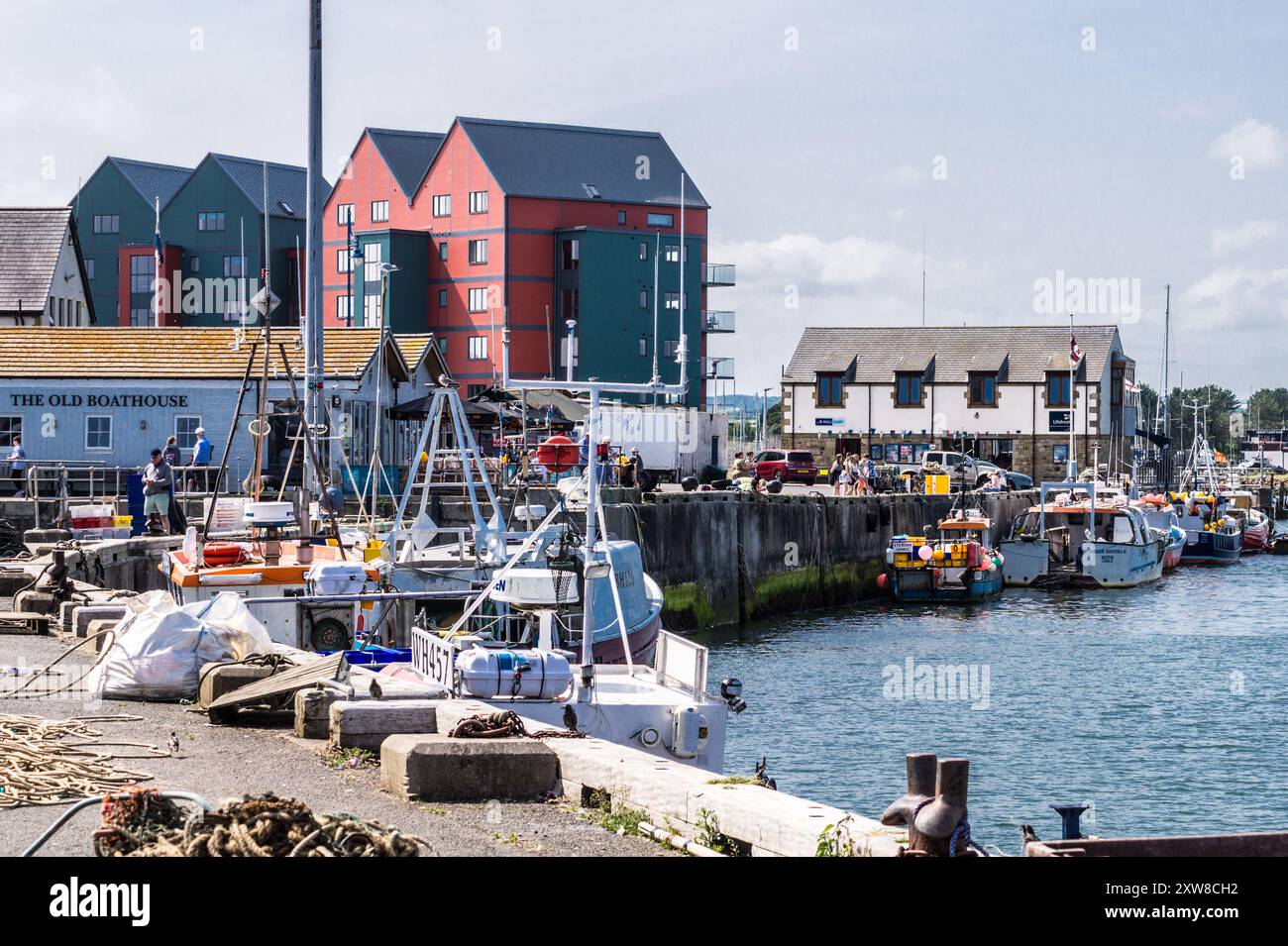 Fishing boats at the quayside, Amble Harbour Village, Northumberland ...