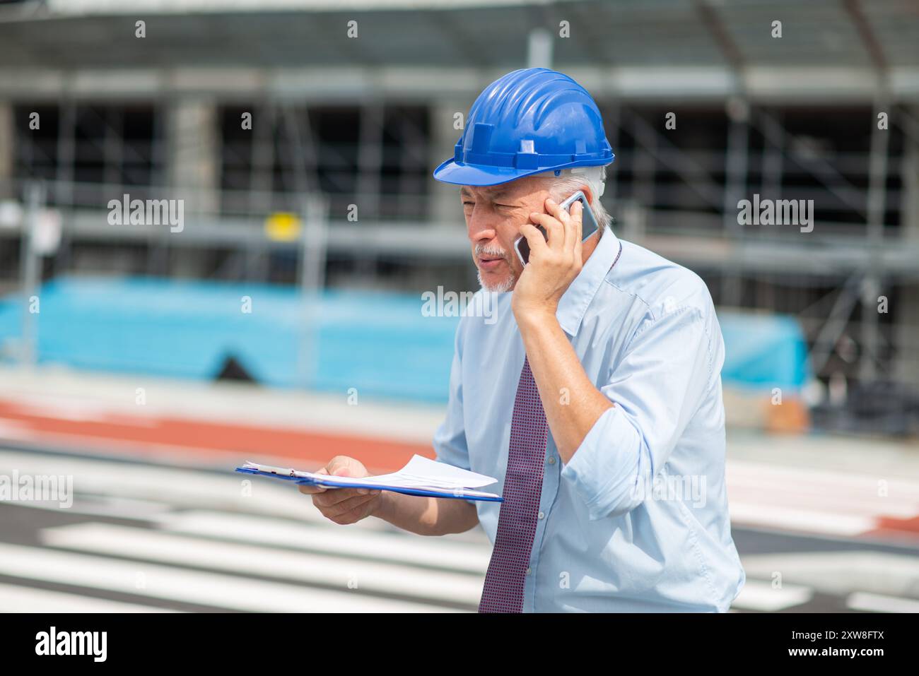 Angry construction foreman talking on hi-res stock photography and ...