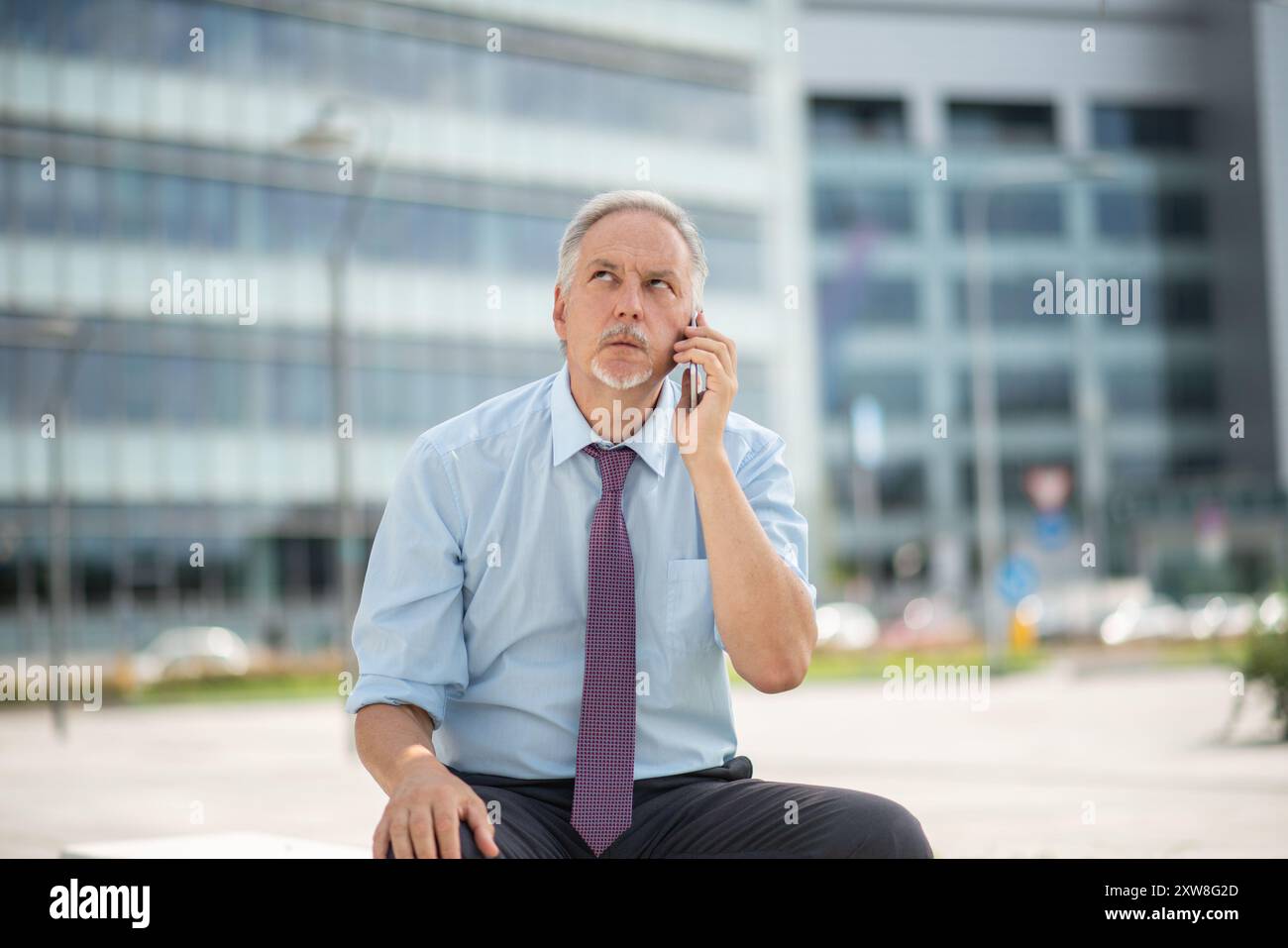 Angry senior business man yelling at the phone outdoor Stock Photo - Alamy