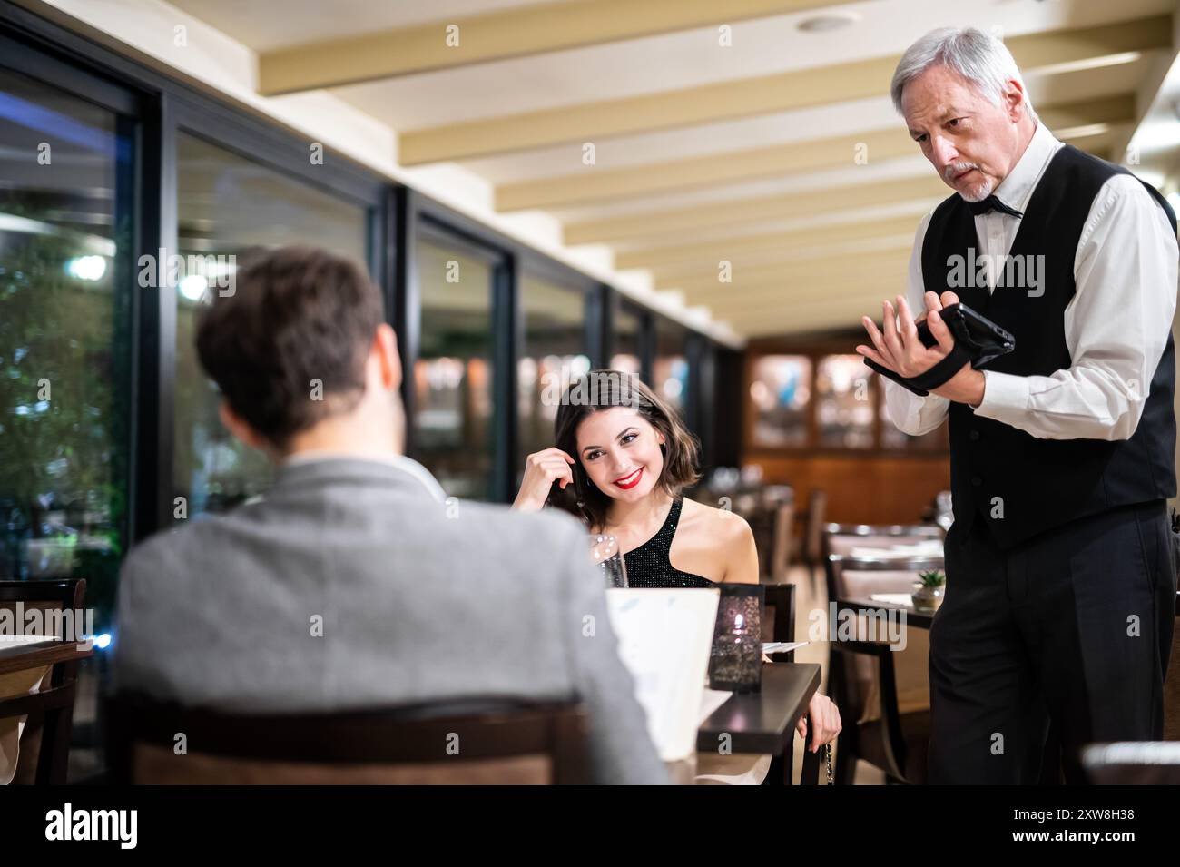 Waiter taking order couple hi-res stock photography and images - Alamy