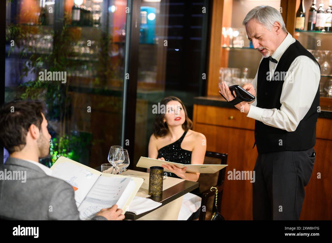Waiter taking order restaurant table hi-res stock photography and ...
