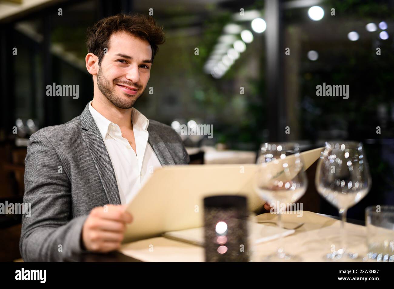 Guy looking at menu hi-res stock photography and images - Alamy