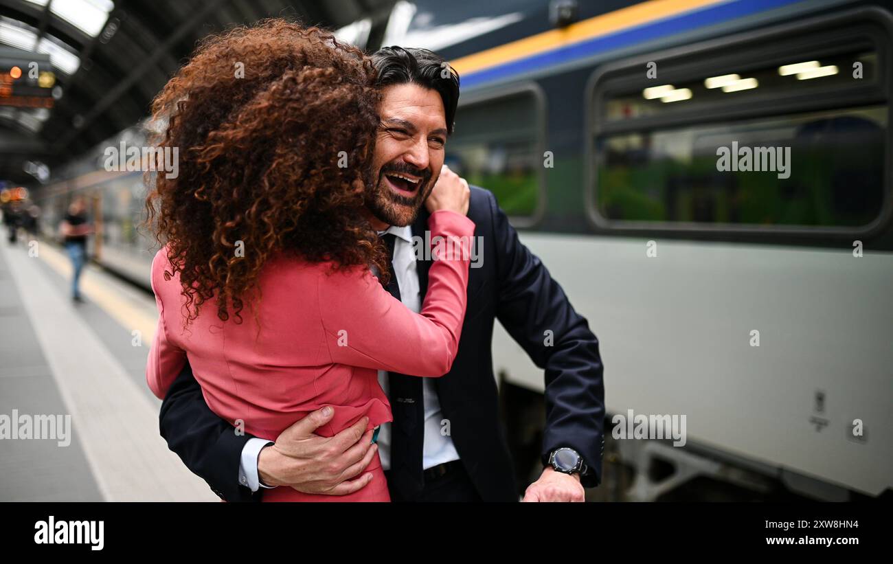 Beautiful couple hugging after long separation Stock Photo - Alamy