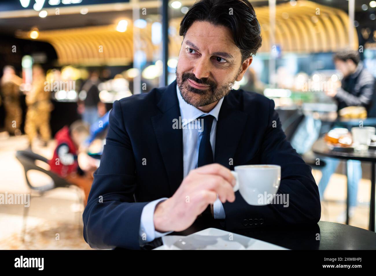 Manager having a coffee in a cafe Stock Photo - Alamy