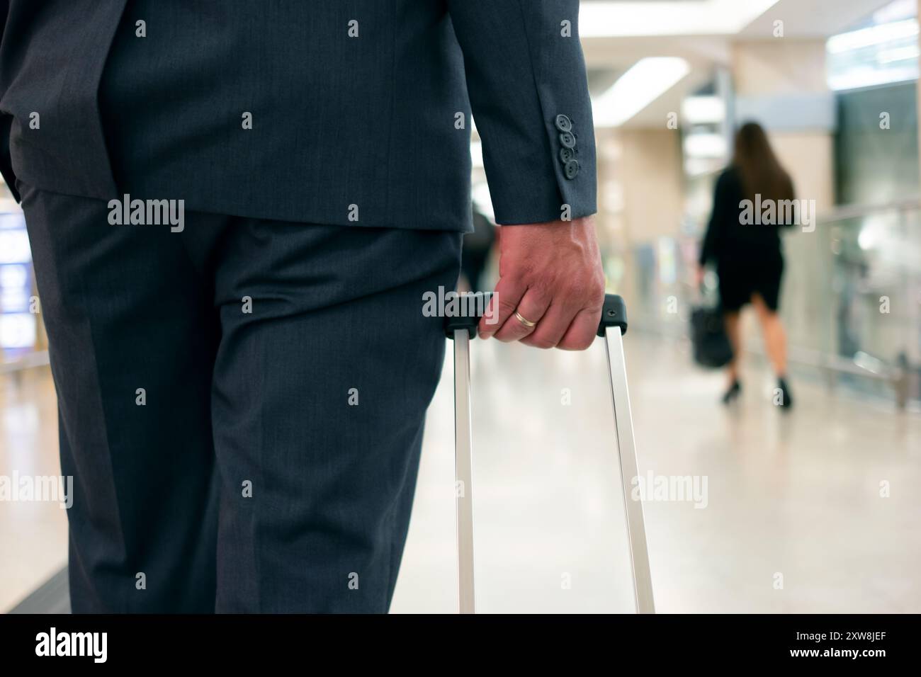 Man pushing trolley in airport hi-res stock photography and images - Alamy