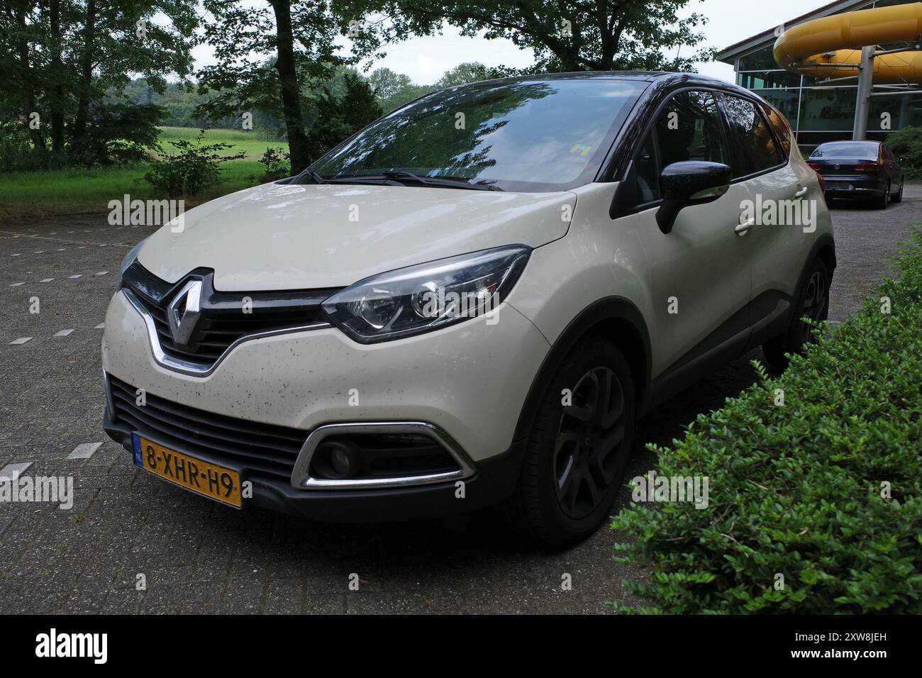 Uelsen, Germany - Aug 14 2024 A white Renault Captur from 2014 is ...
