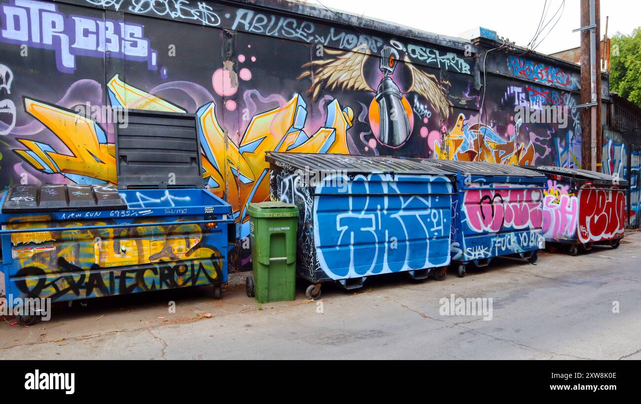 Garbage Containers with Graffiti Stock Photo - Alamy