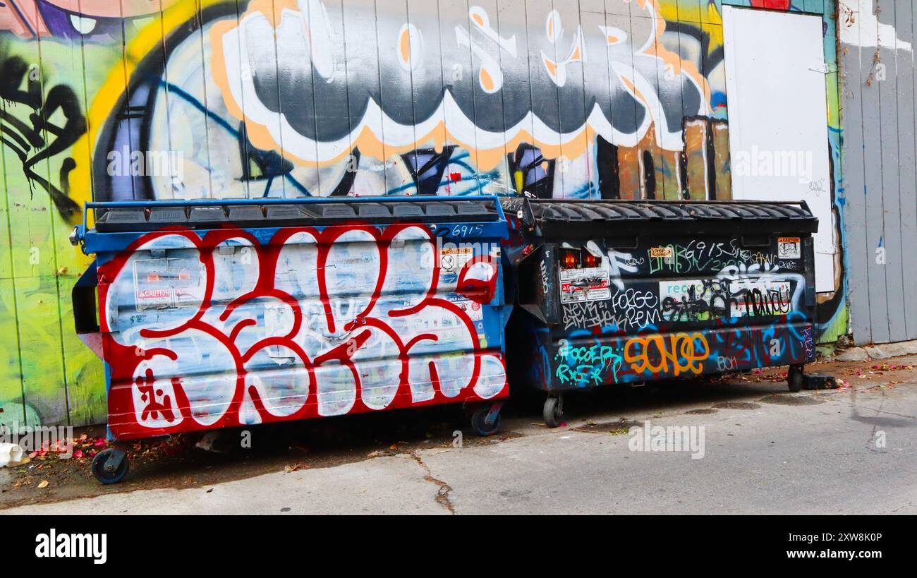Garbage Containers with Graffiti Stock Photo - Alamy