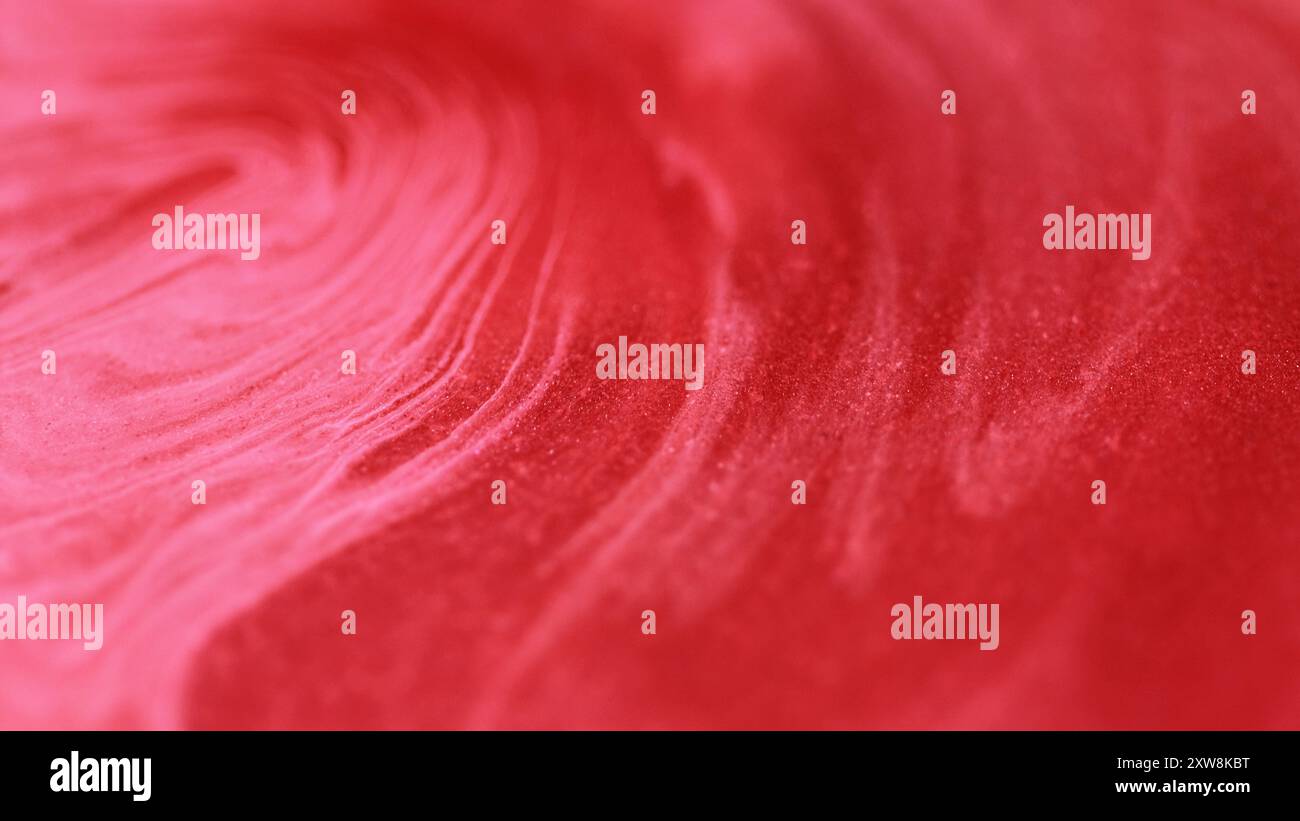 Sparkling glitter. Shimmering liquid. Defocused red emulsion swirl ...