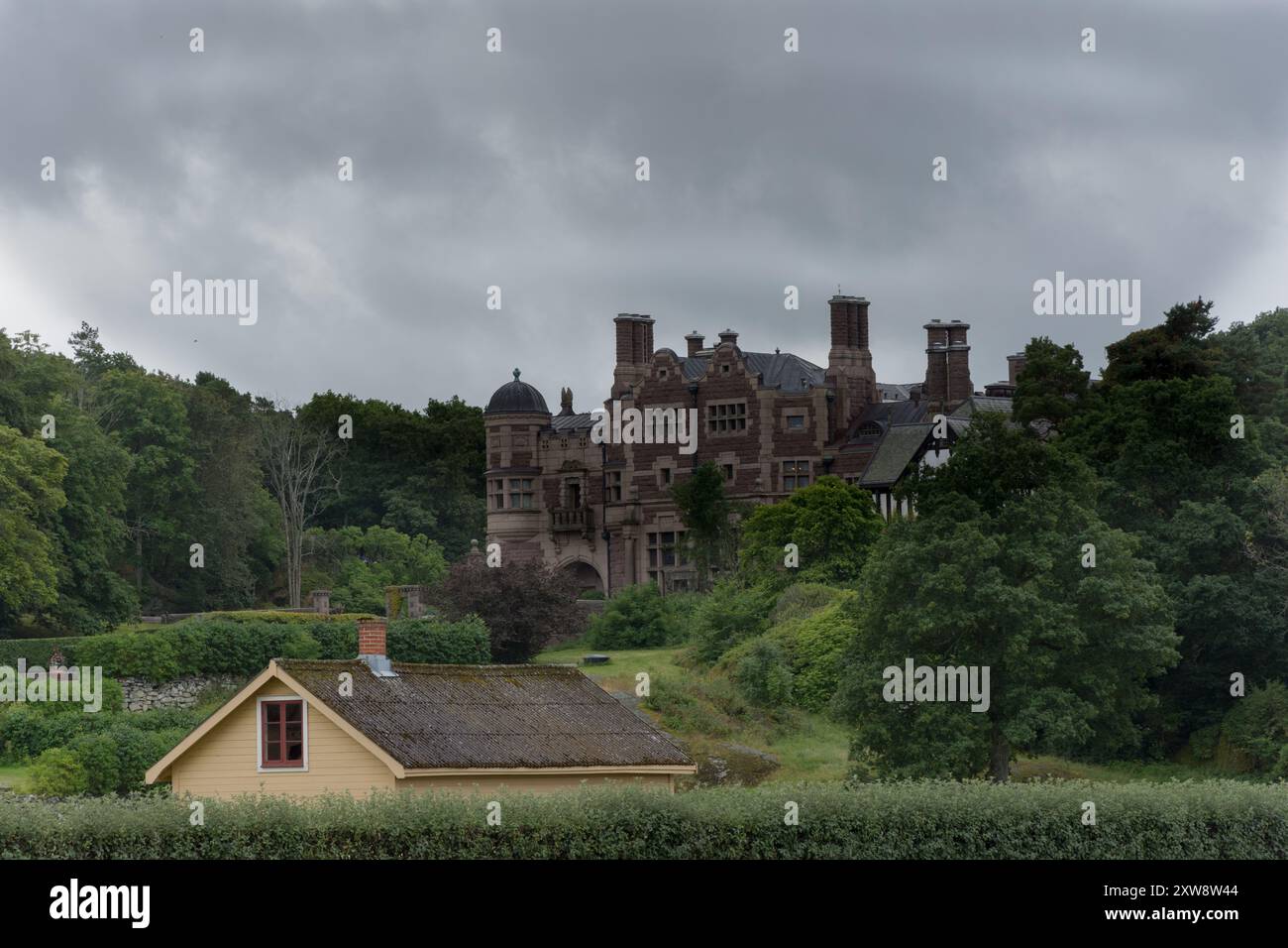 Stone castle with garden Stock Photo - Alamy