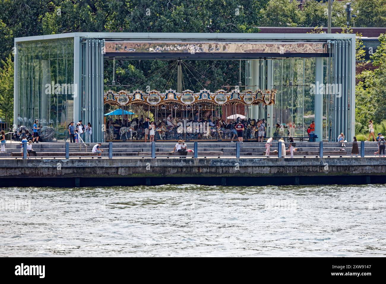 Jane’s Carousel stands in the shadow of the Brooklyn Bridge. The glass ...